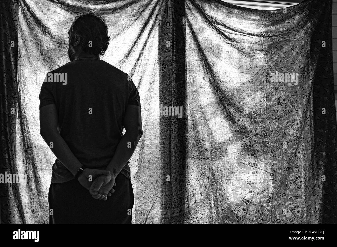 Mature man standing rear view Black and White Stock Photos & Images - Alamy