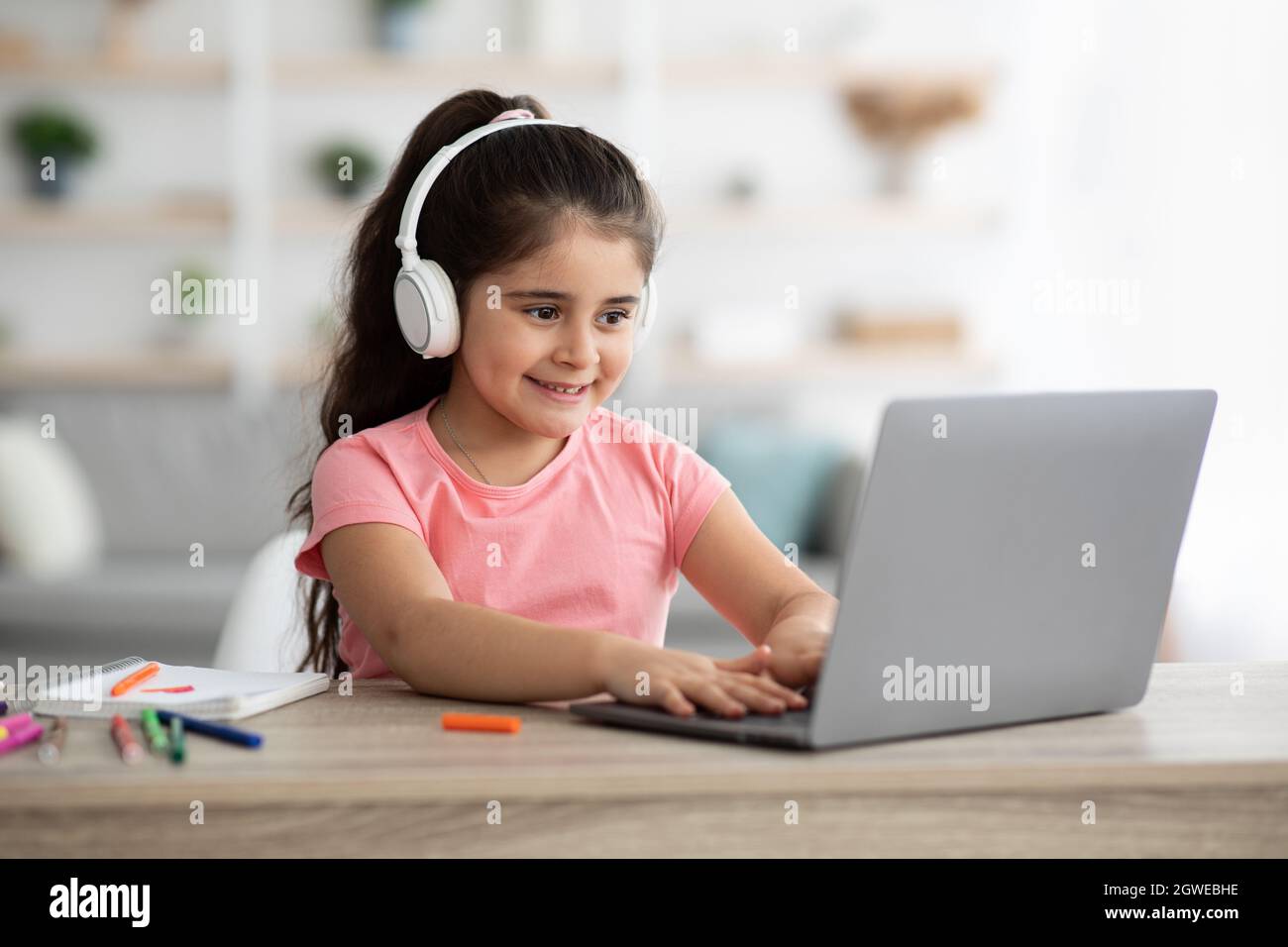 Distance Learning. Little Arab Girl Study At Home With Laptop Computer ...