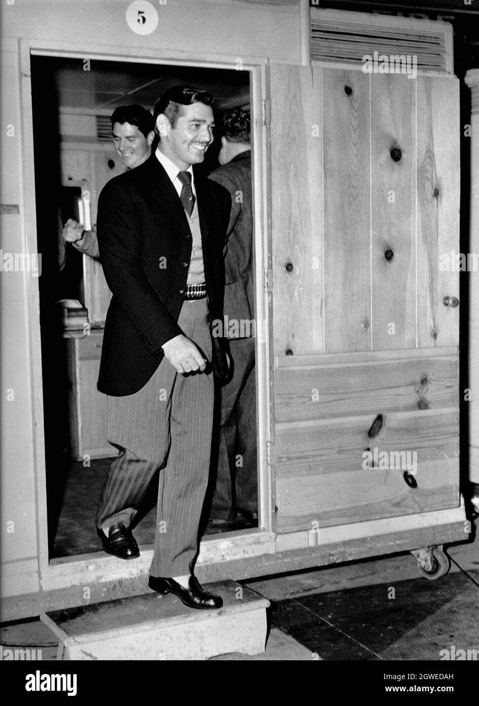 CLARK GABLE on set candid leaving his dressing room (where his ...