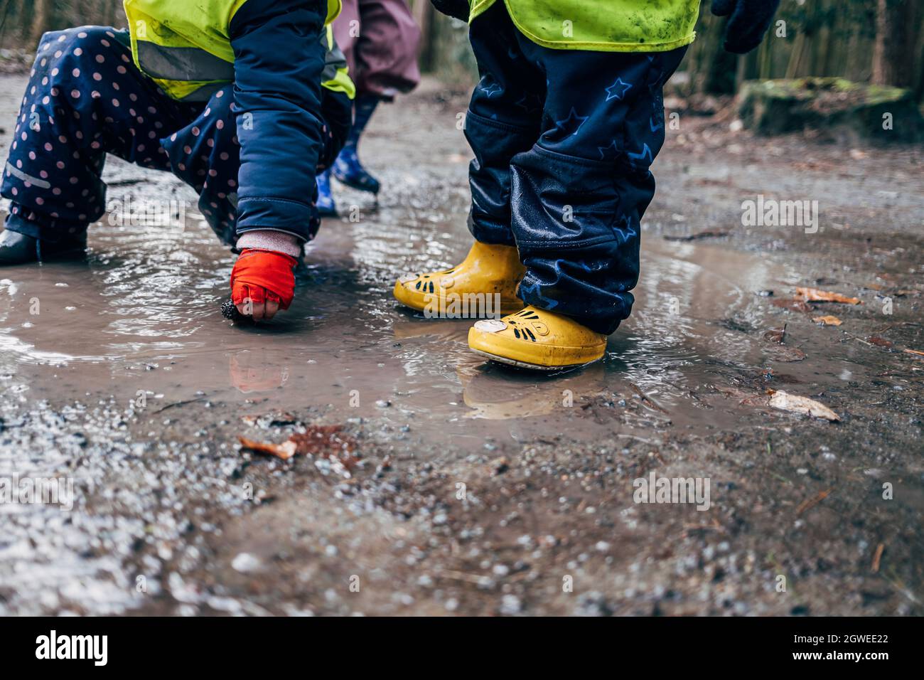 Child puddle adult splash hi-res stock photography and images - Alamy