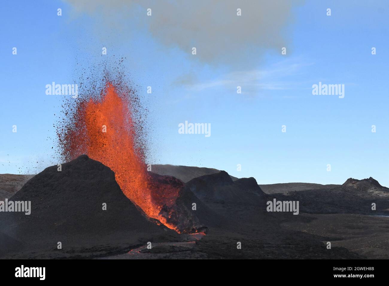 Volcanic vent at Fagradalsfjall, Iceland, erupting orange and red lava ...