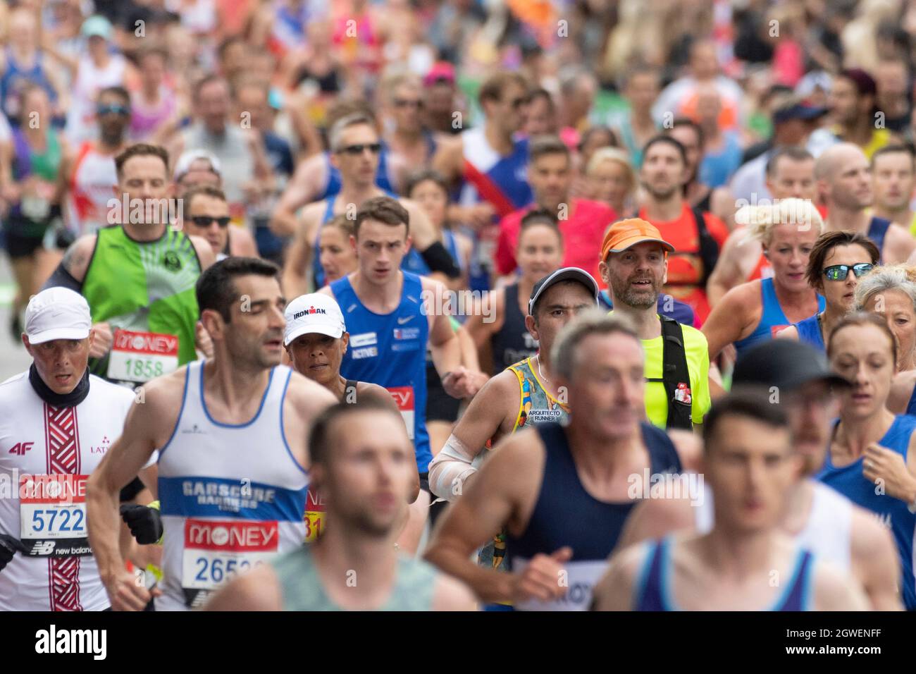03/10/2021. London, UK. Runners run past the Cutty Sark during the ...