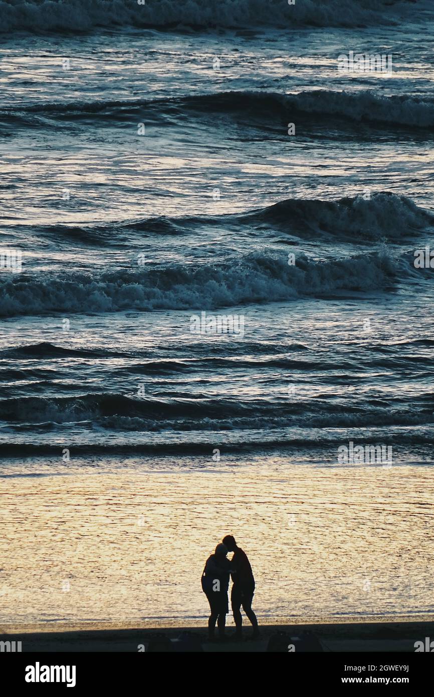 Standing against wind two people hi-res stock photography and images ...