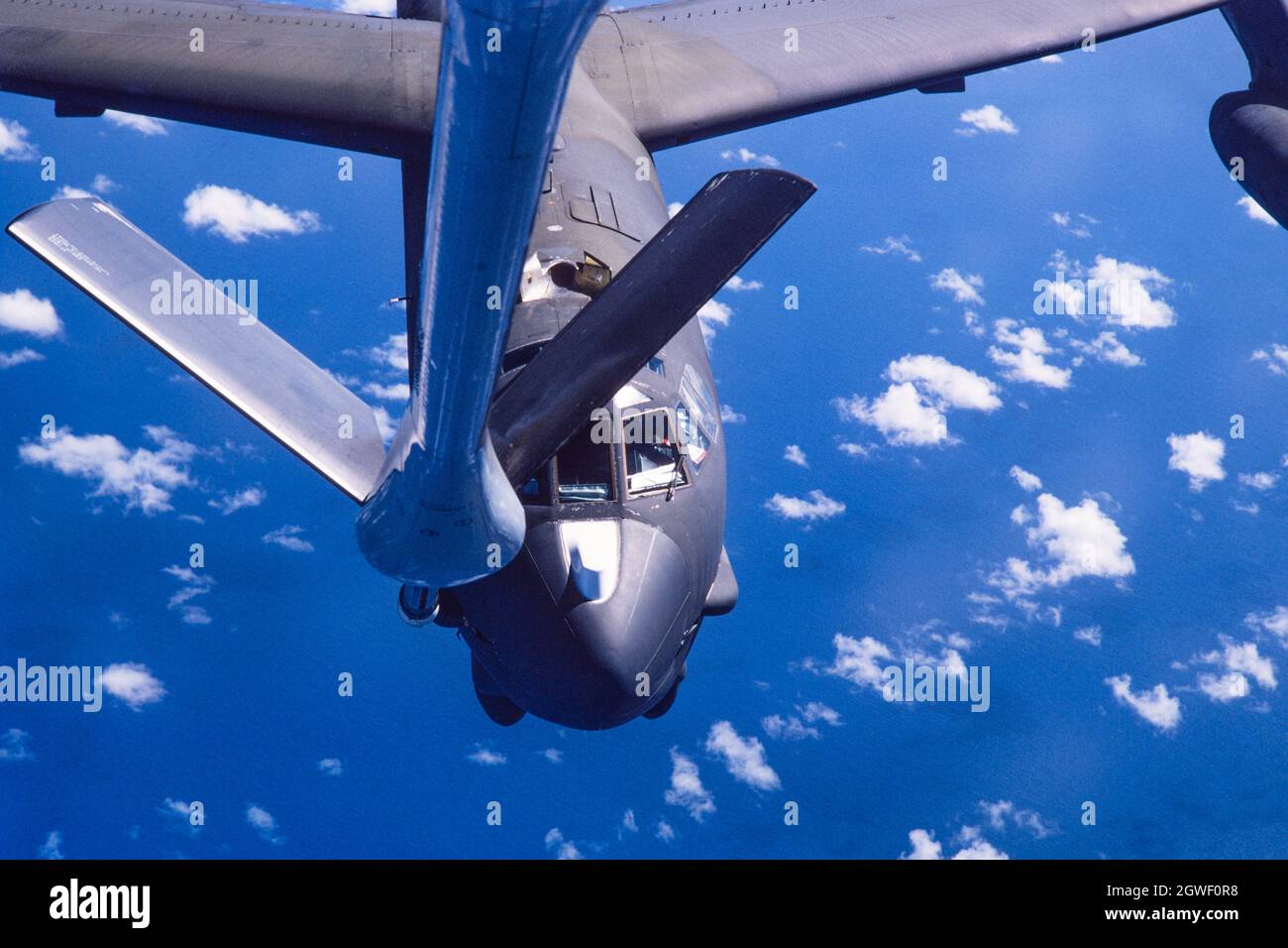 A U.S. Air Force B-52 bomber lines up for an aerial refueling by a KC ...