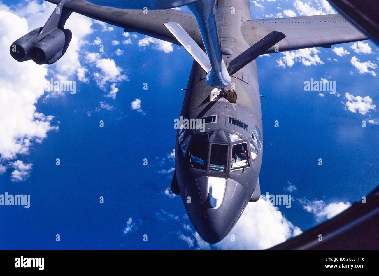 Aerial refueling of a U.S. Air Force B-52 bomber by a KC-135 tanker ...