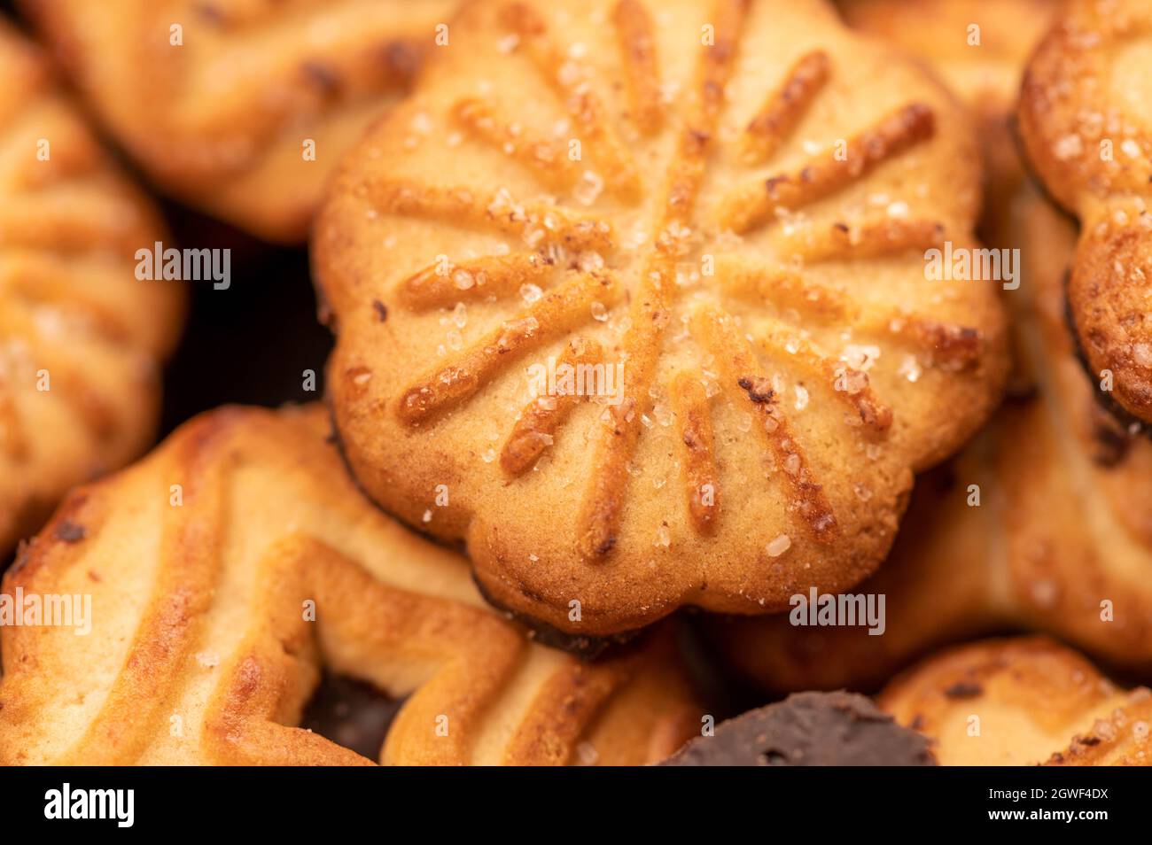 Curly cookies covered with chocolate icing, background image, close-up ...