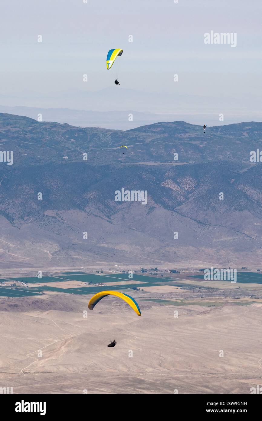 Four paragliders soar over the Sevier Valley with the Pahvant Range in ...