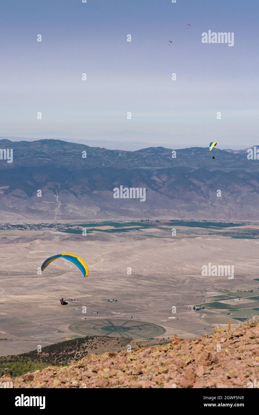 Six paragliders soar over the Sevier Valley with the Pahvant Range in ...
