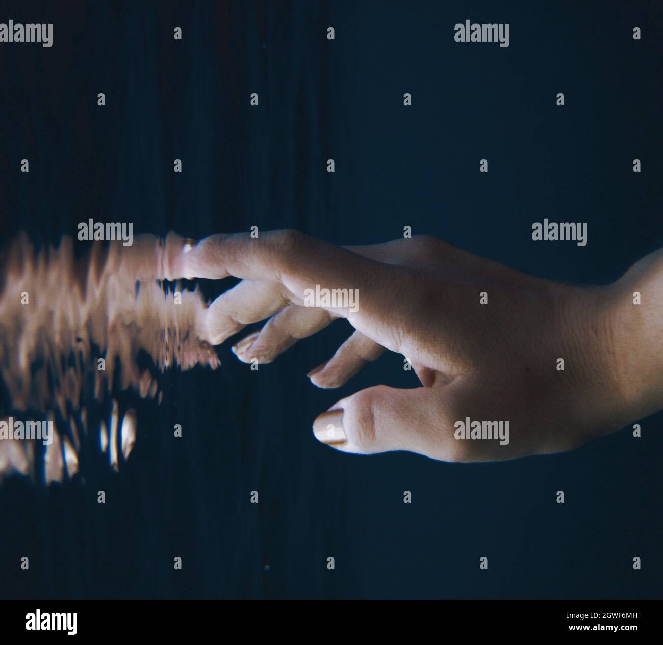 Hand reaching up underwater hi-res stock photography and images - Alamy