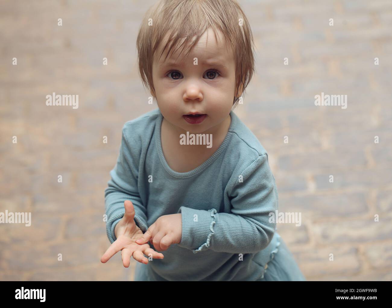 Cute little baby girl. Developing Fine Motor Skills Stock Photo - Alamy