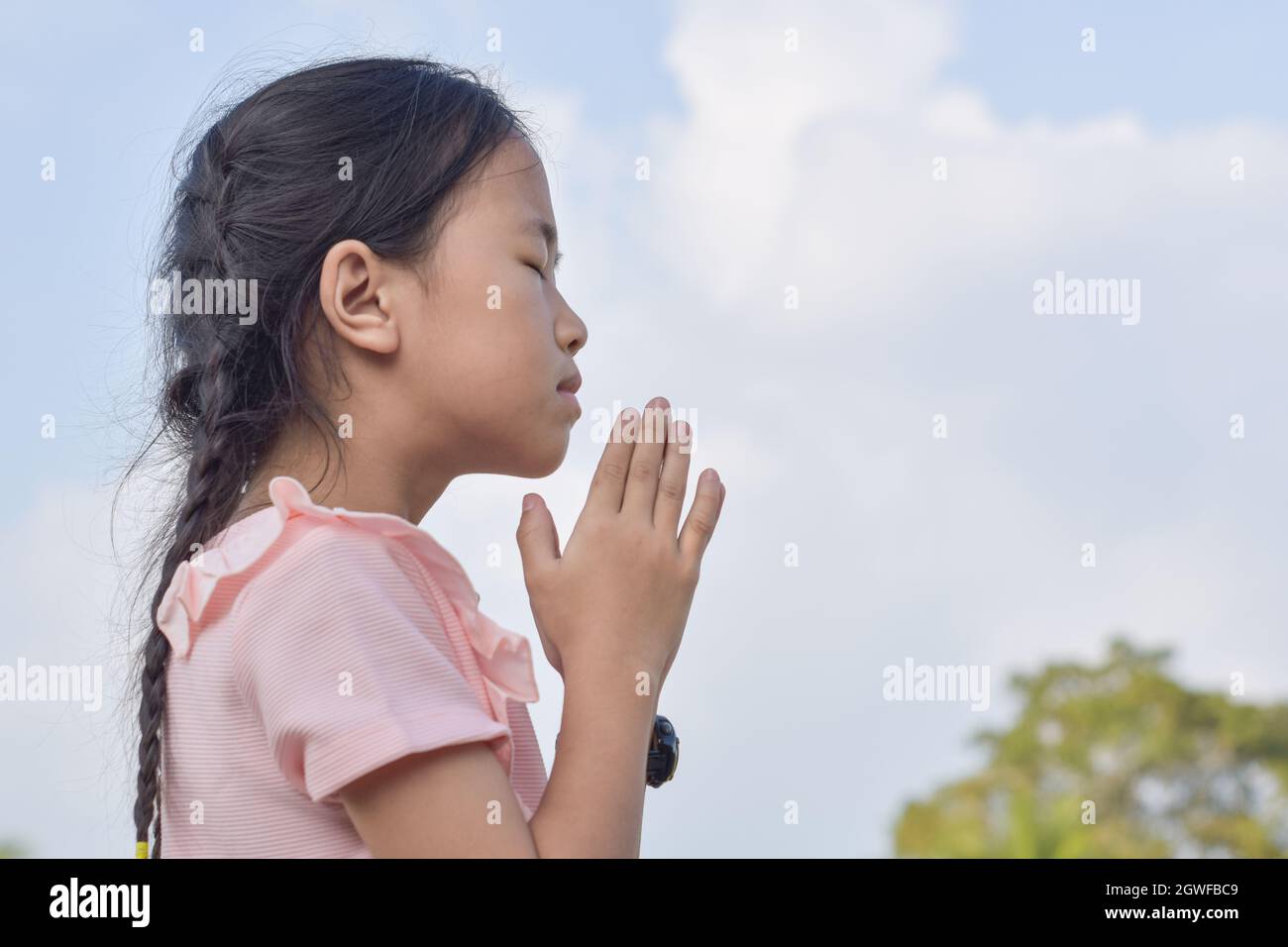 Black child prayer hands hi-res stock photography and images - Alamy