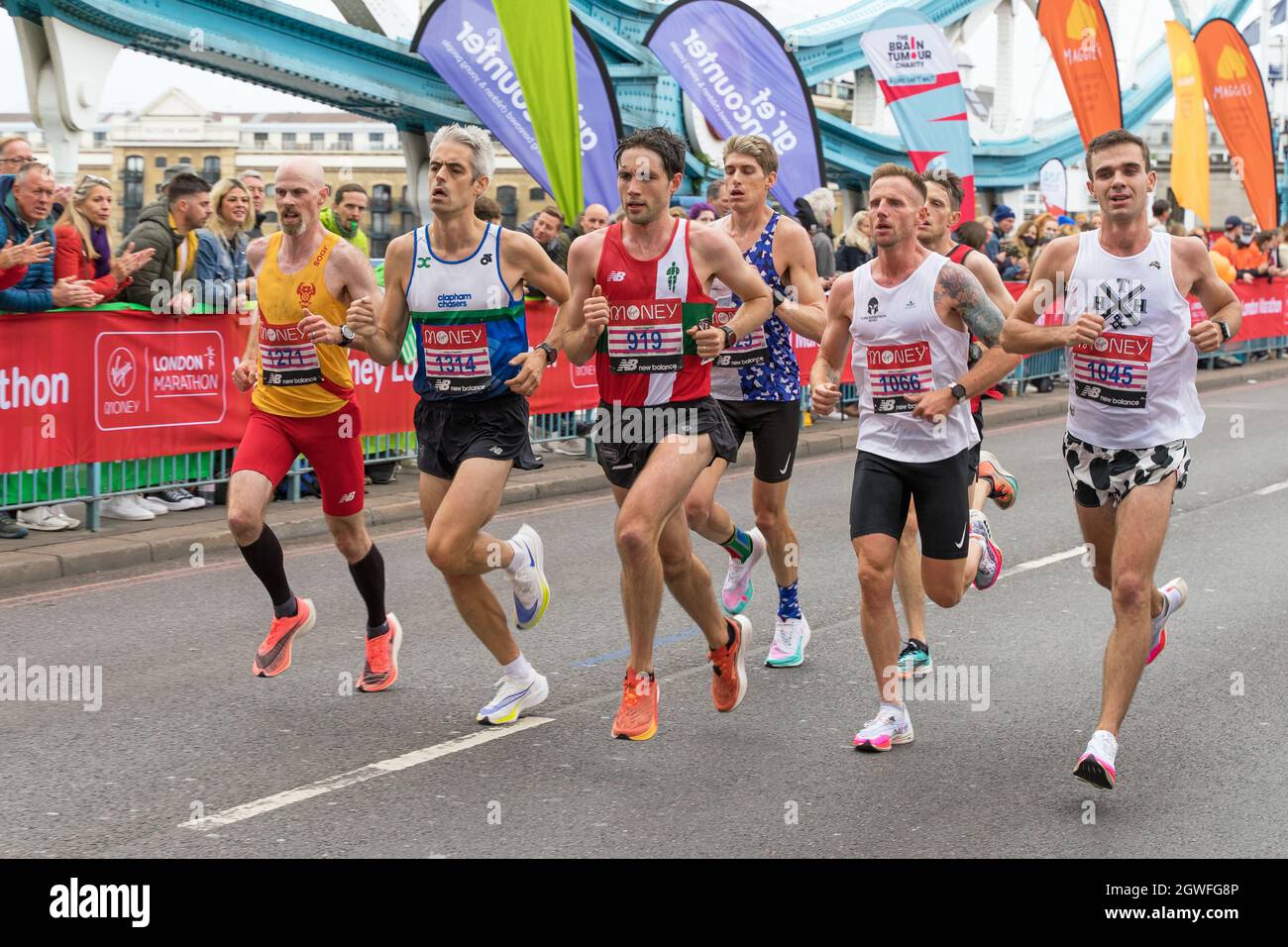 Runners completing the 41st London Marathon running over Tower Bridge ...