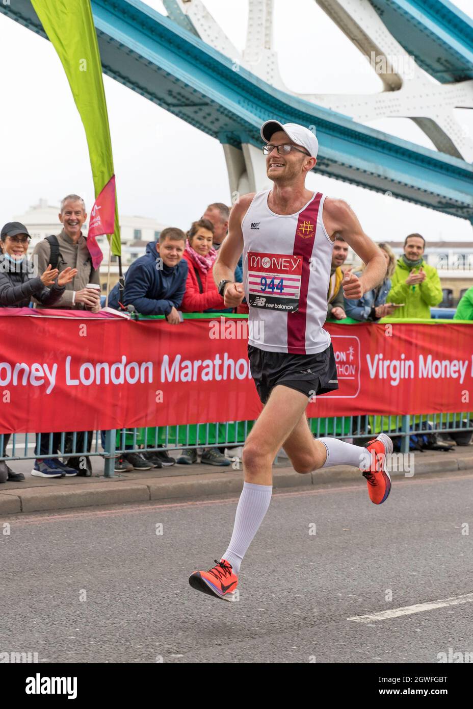Runners completing the 41st London Marathon running over Tower Bridge ...