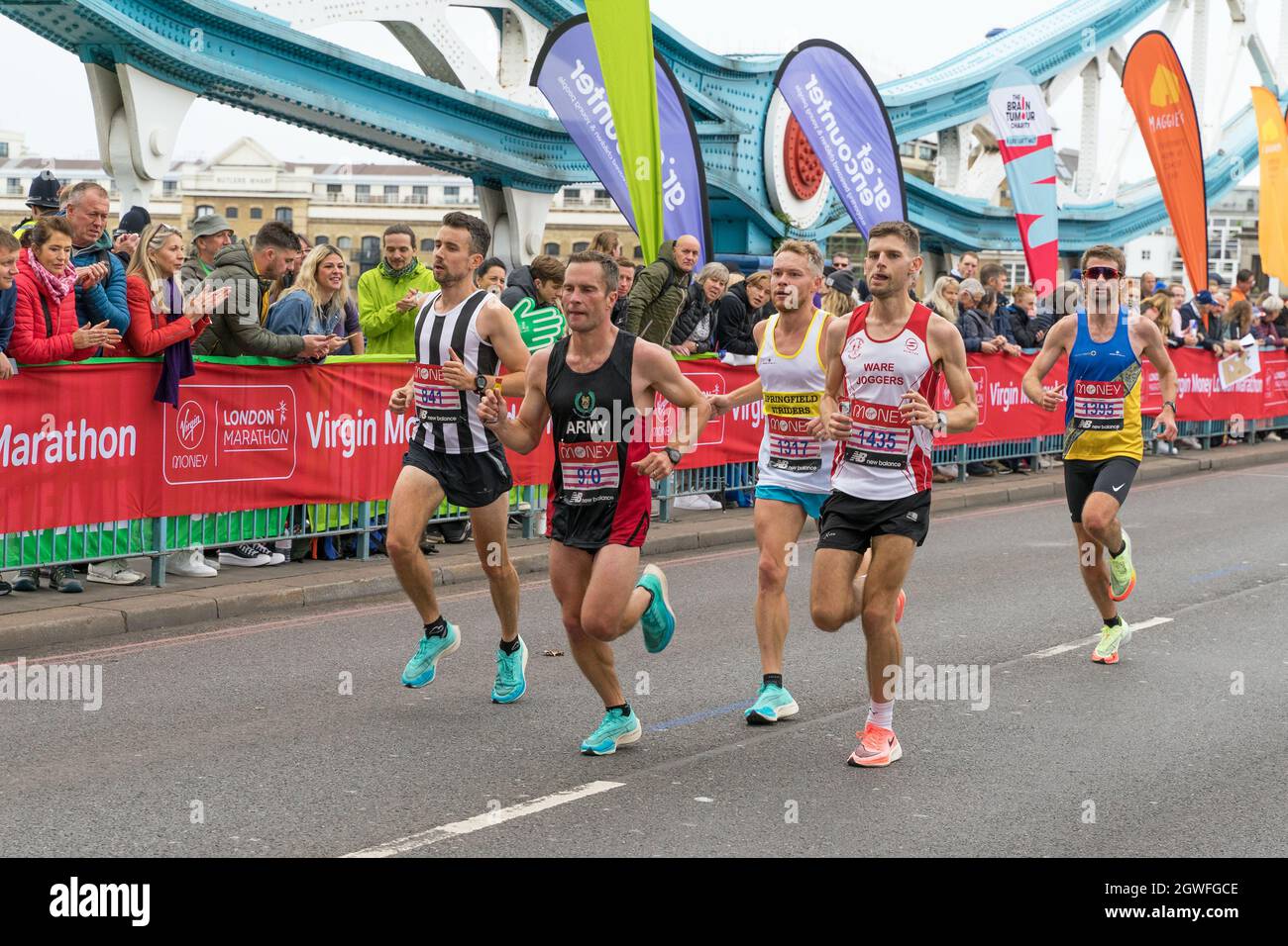 Runners completing the 41st London Marathon running over Tower Bridge ...