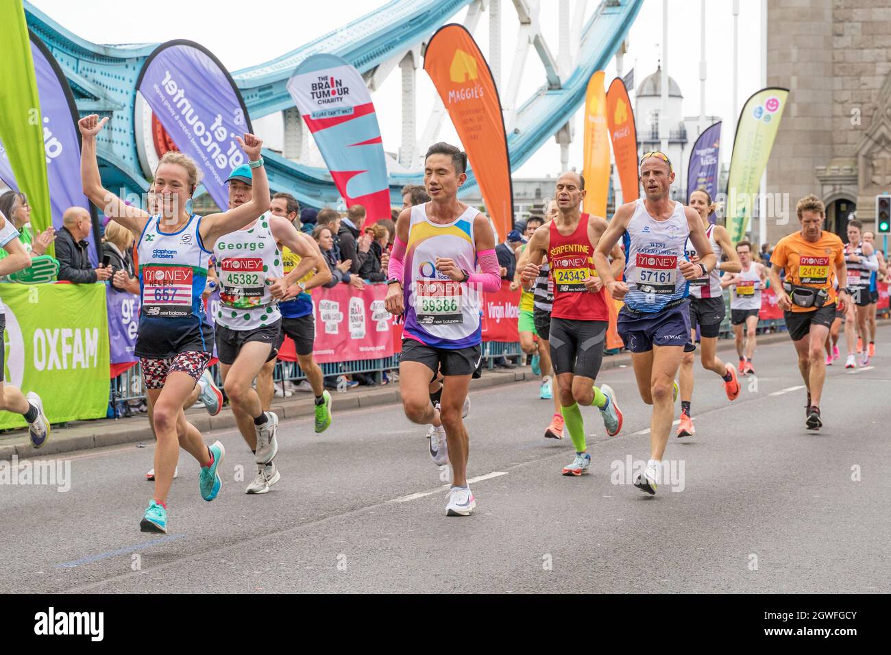 Runners completing the 41st London Marathon running over Tower Bridge ...
