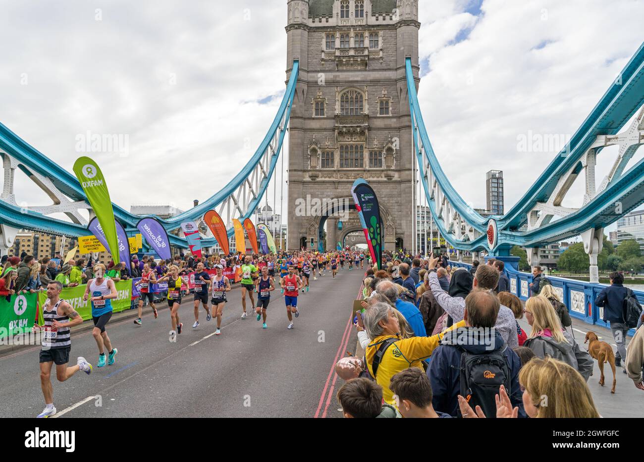 Runners completing the 41st London Marathon running over Tower Bridge ...