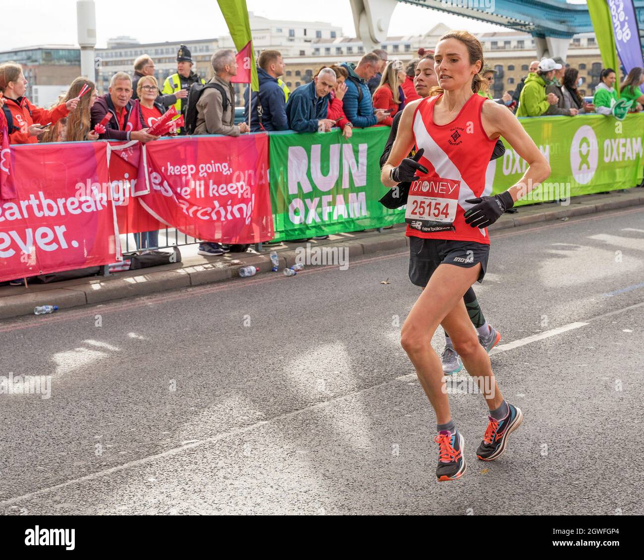 Runners completing the 41st London Marathon running over Tower Bridge ...