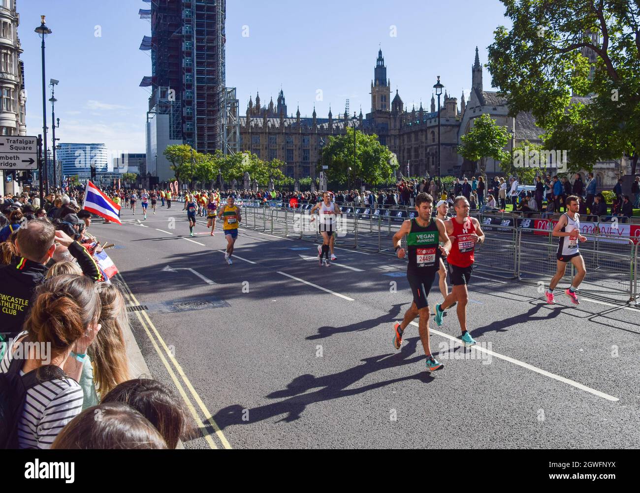 London, United Kingdom. 3rd October 2021. Runners pass through ...
