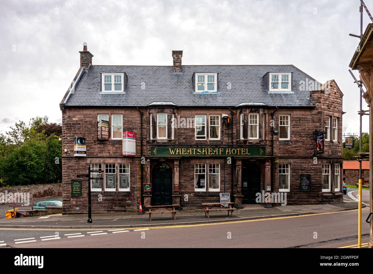 An old fashioned stone built hotel and public bar with engraved frosted ...