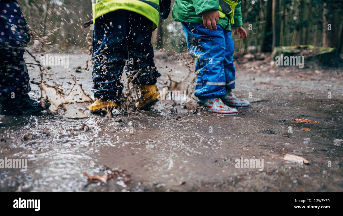 Child puddle adult splash hi-res stock photography and images - Alamy