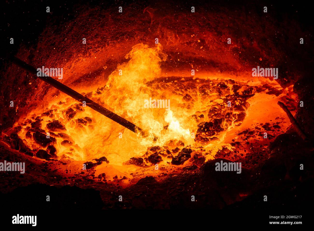 process of taking a sample of liquid metal in a steelmaking furnace ...