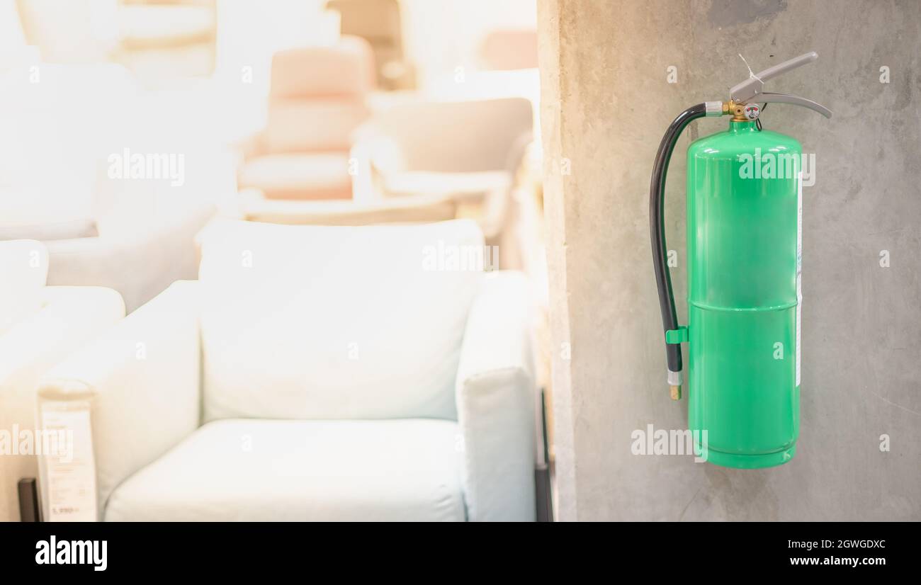 Fire extinguisher hanging on wall hi-res stock photography and images ...