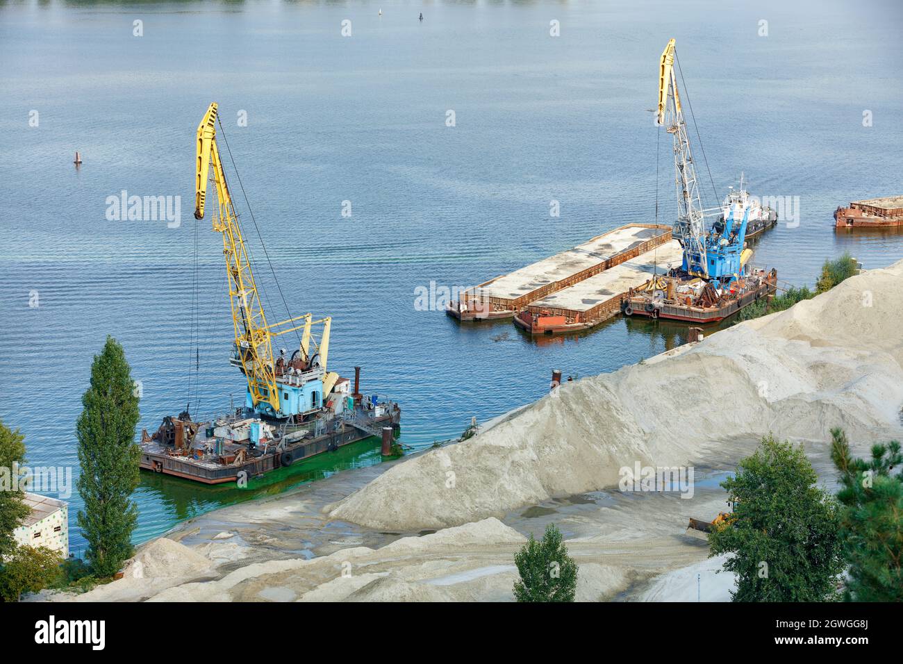 River industrial transport and equipment. Floating industrial cranes ...