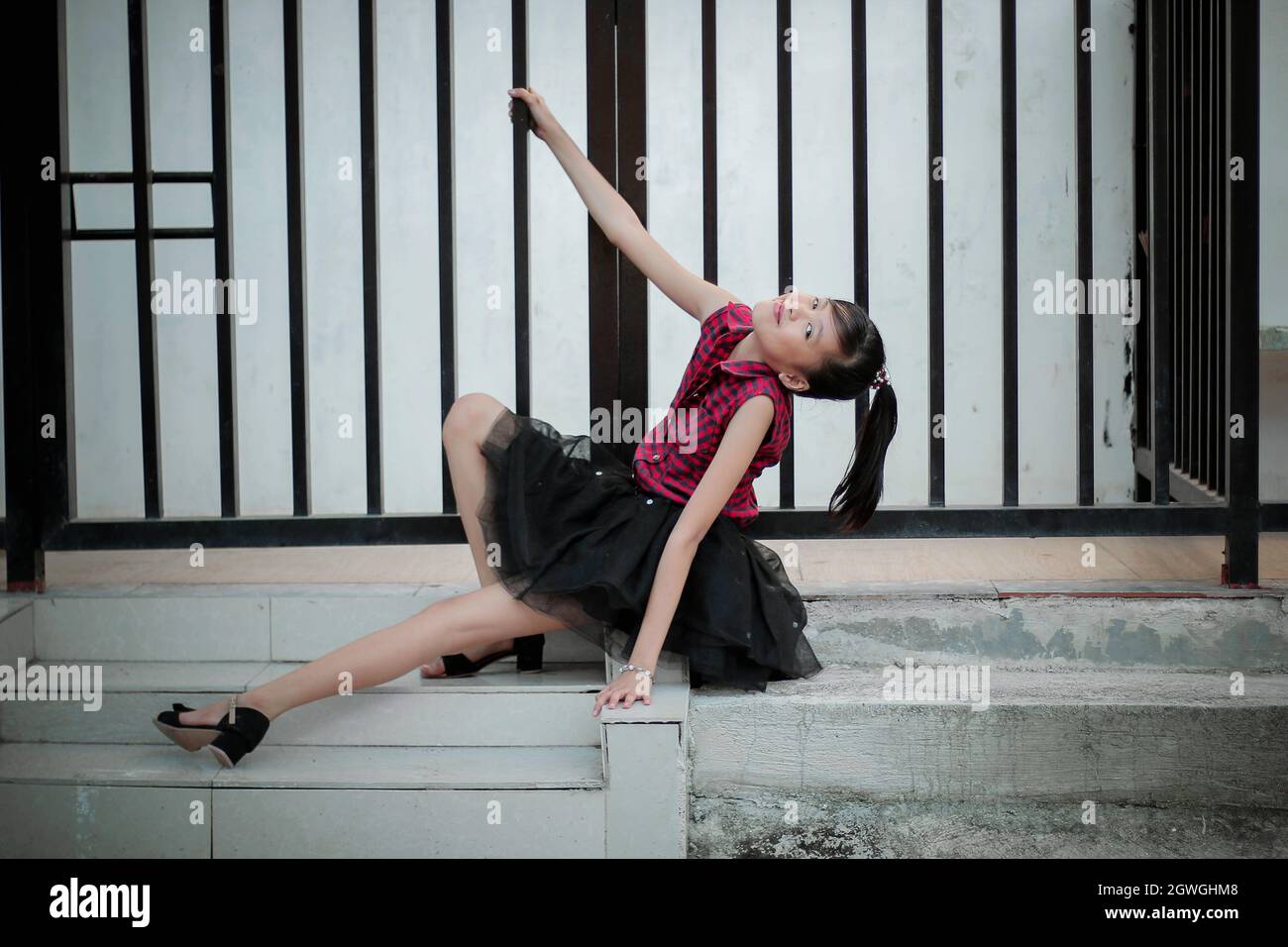 Side View Of Woman Looking At Camera Stock Photo - Alamy