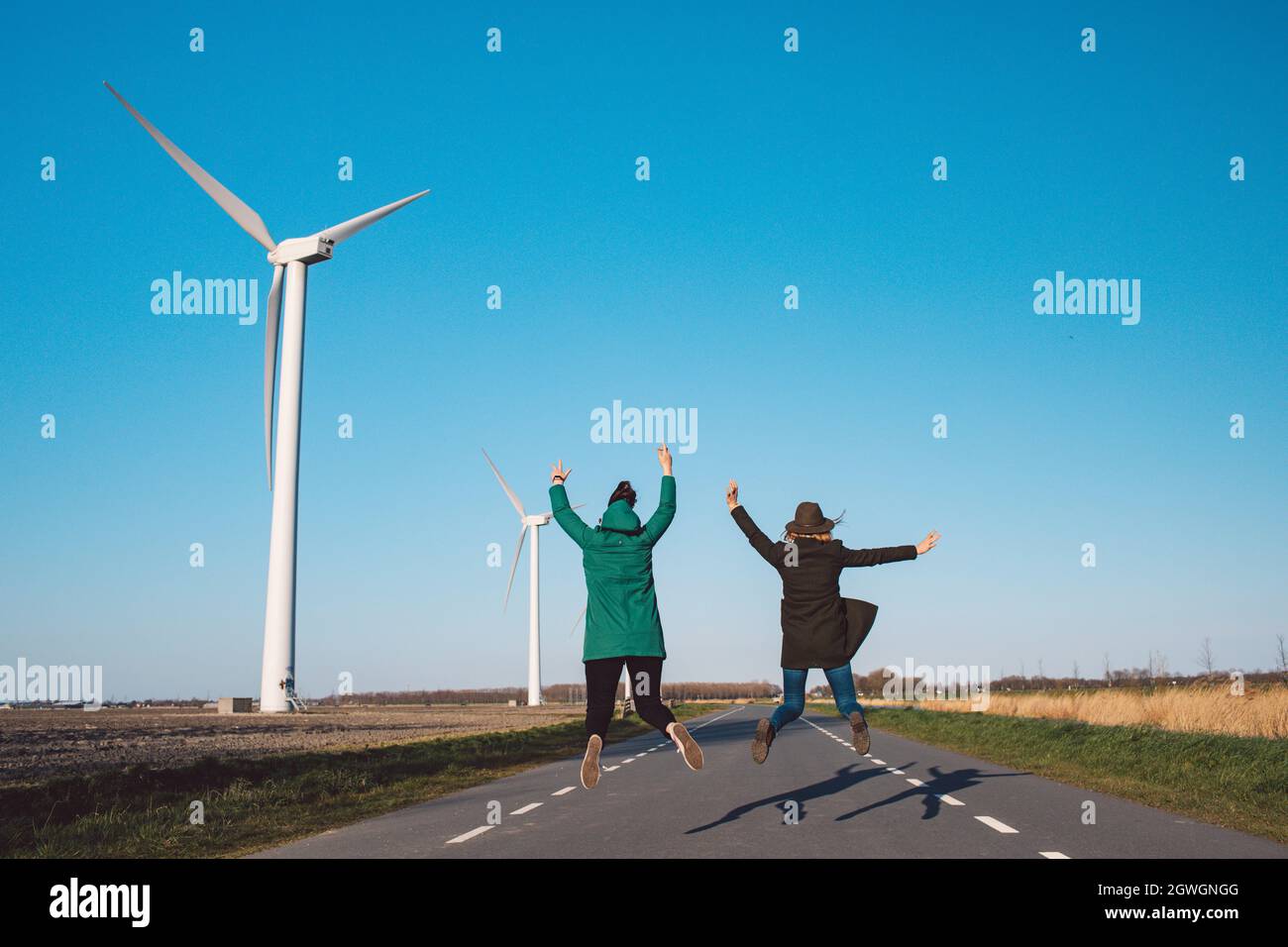Standing against wind two people hi-res stock photography and images ...
