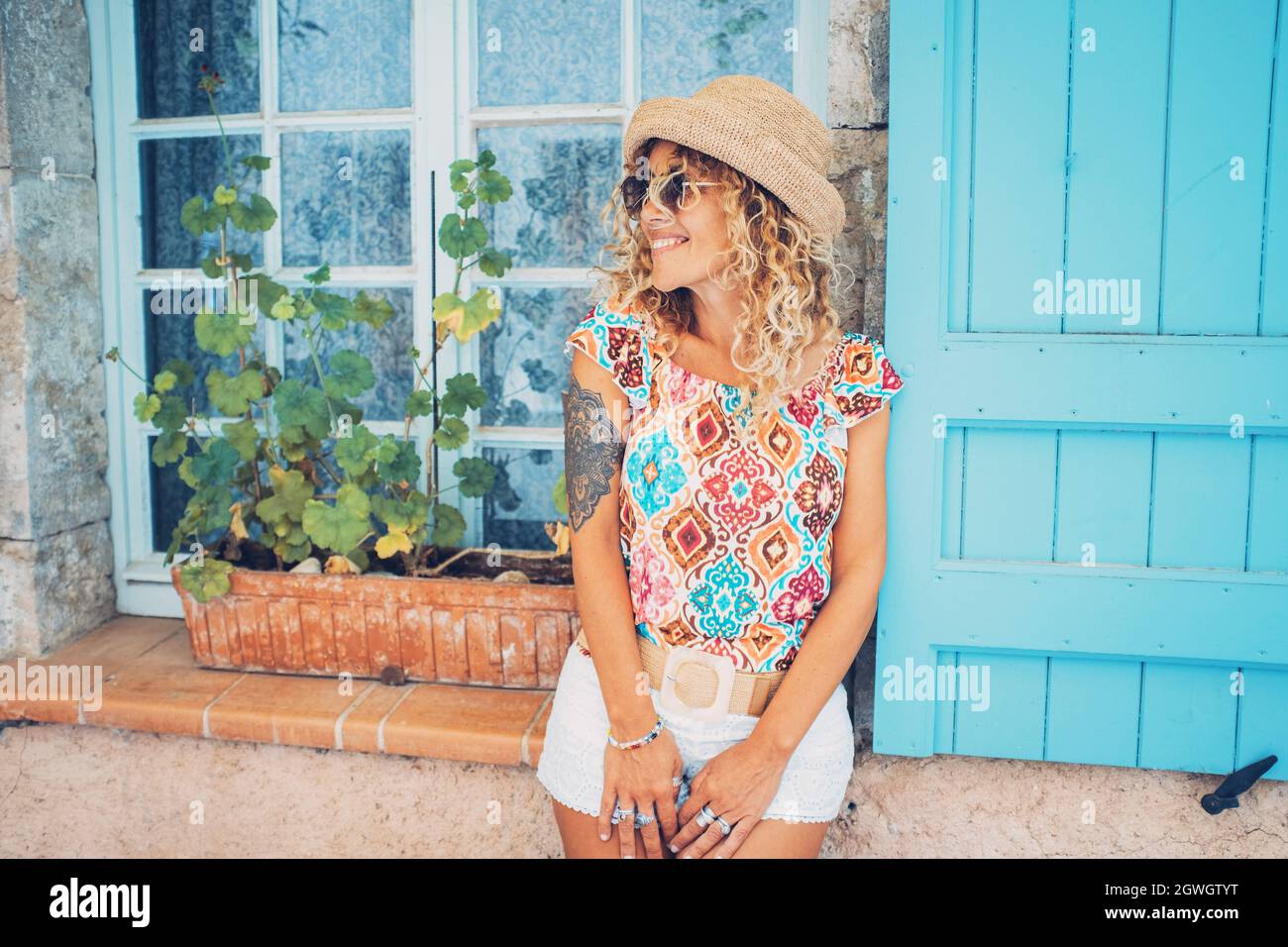 Woman leaning against glass window hi-res stock photography and images ...