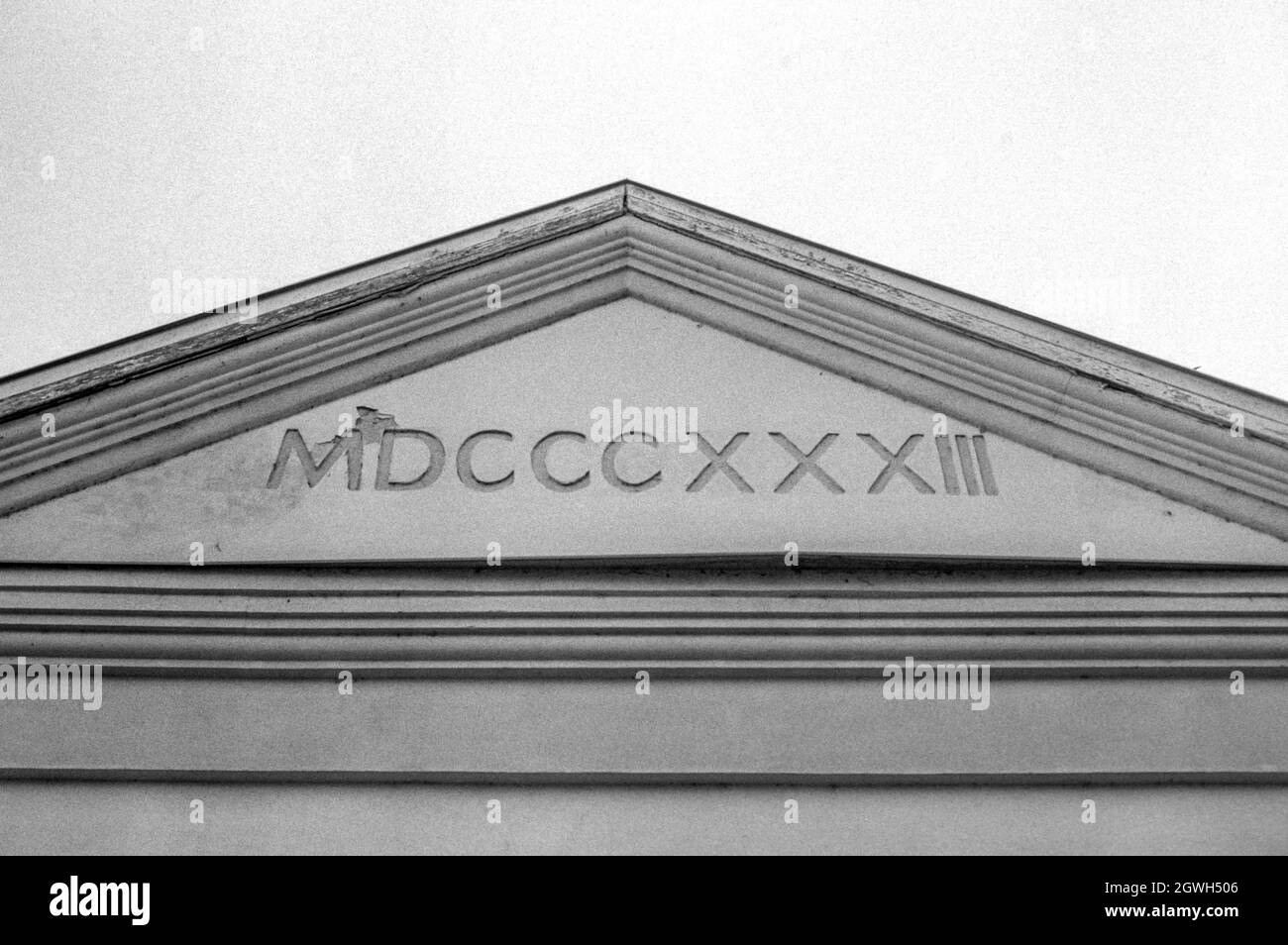 A monochrome shot of a white triangle roof of a building Stock Photo ...