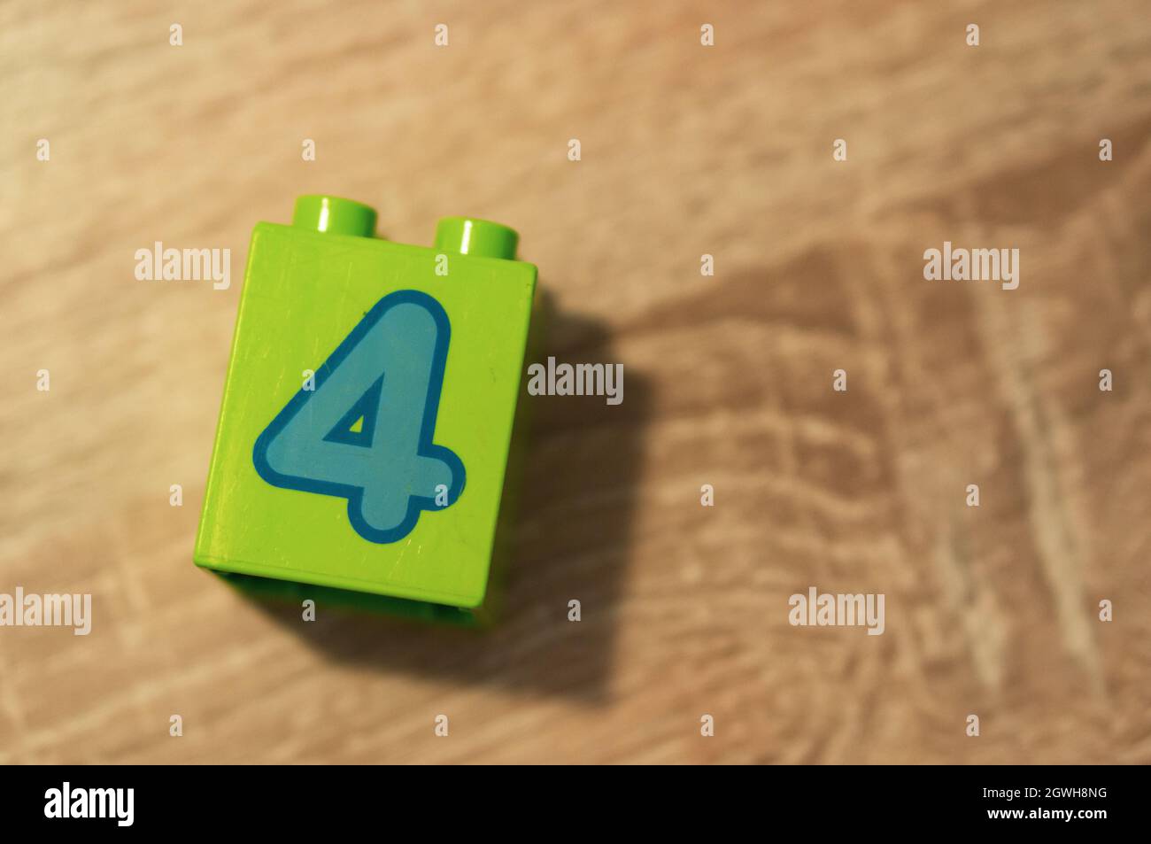 POZNAN, POLAND - May 12, 2020: A Green Lego Duplo block with number 4 ...