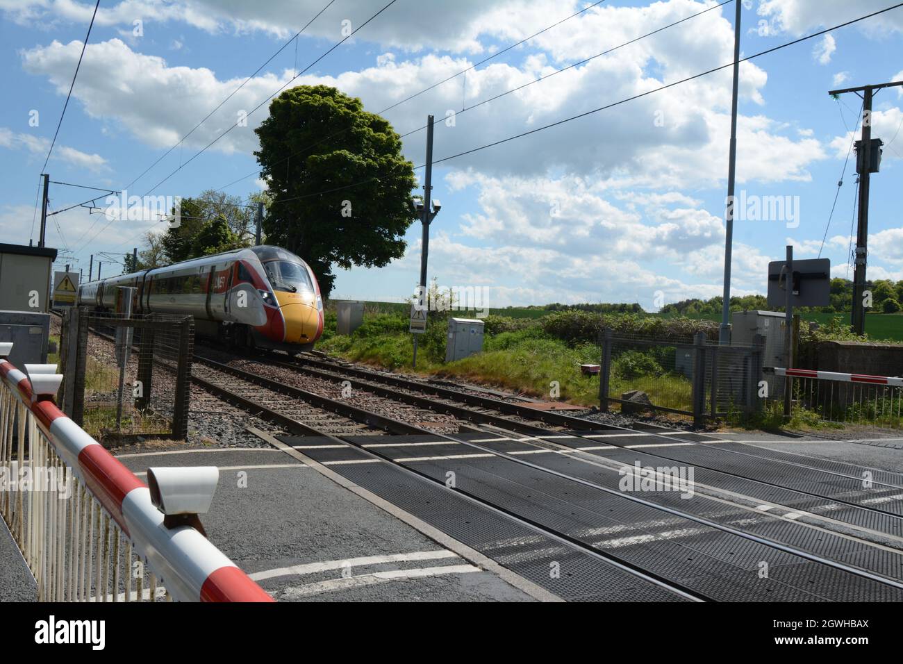 Train at Warrenton Northumberland UK level crossing fast British ...