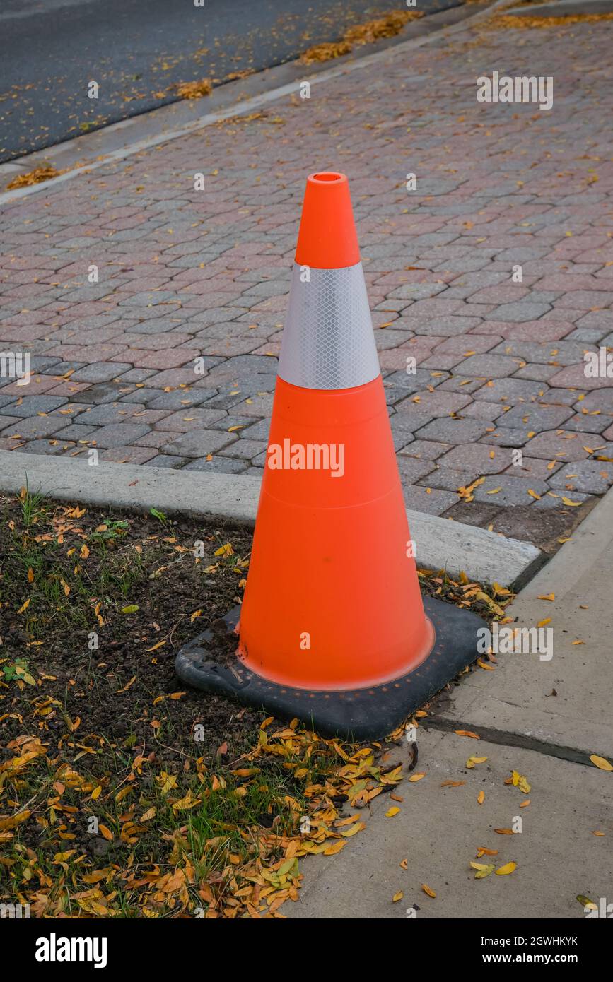 Orange traffic cone sitting on hi-res stock photography and images - Alamy