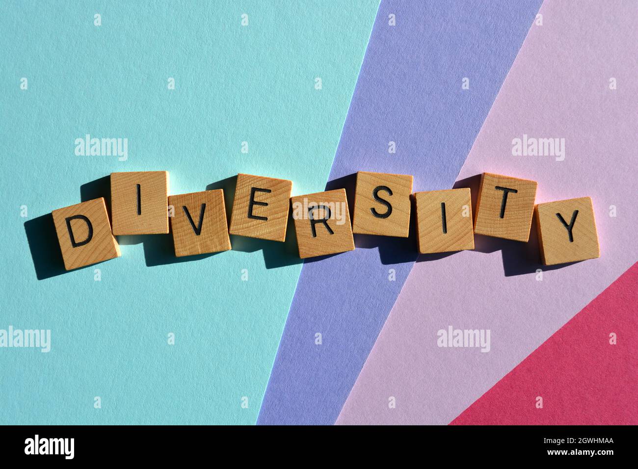 Diversity, Word In Wooden Alphabet Letters Isolated On Multi Coloured ...