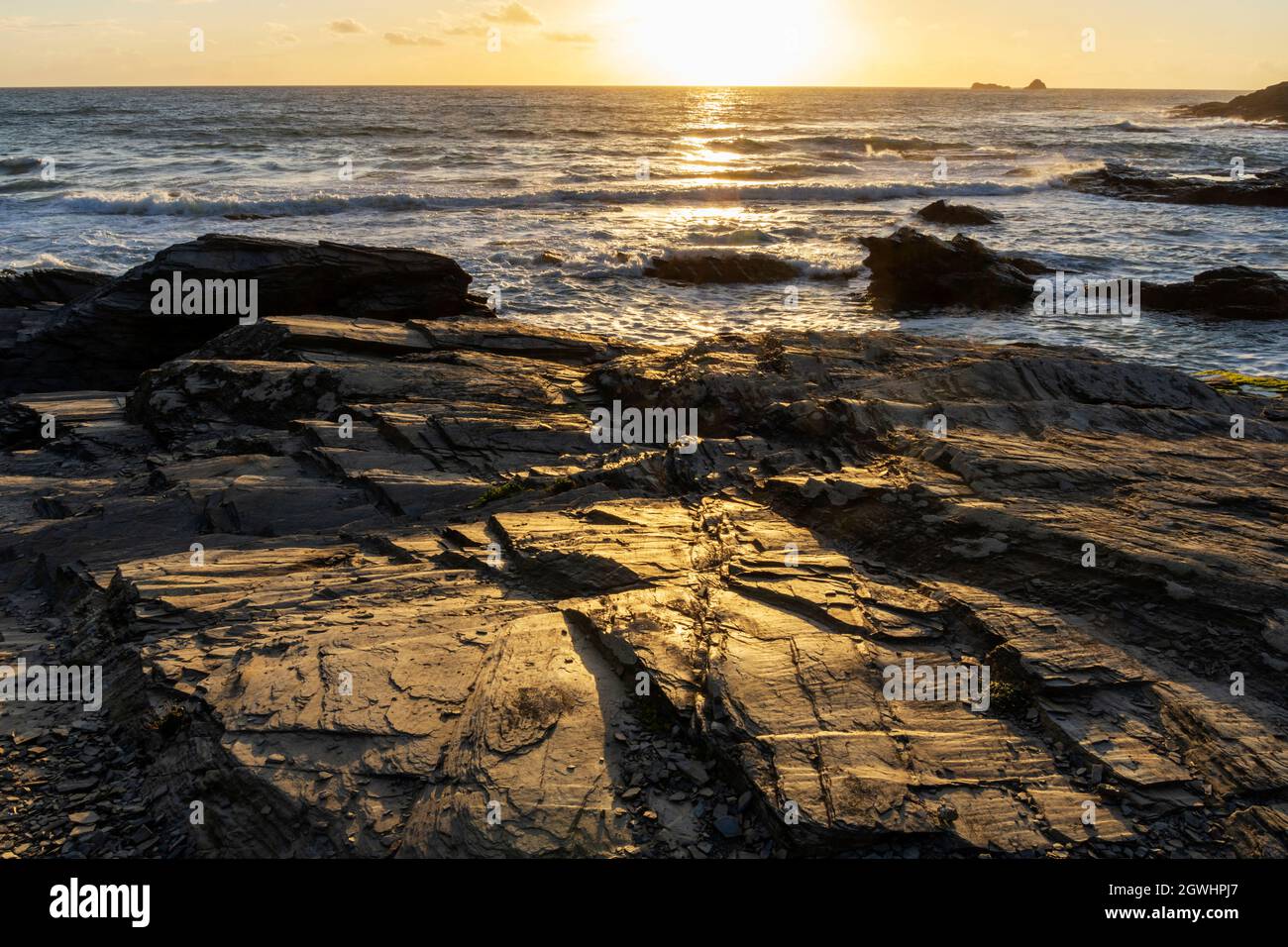 Constantine bay, Cornwall, England, UK as the golden sun sets over the ...