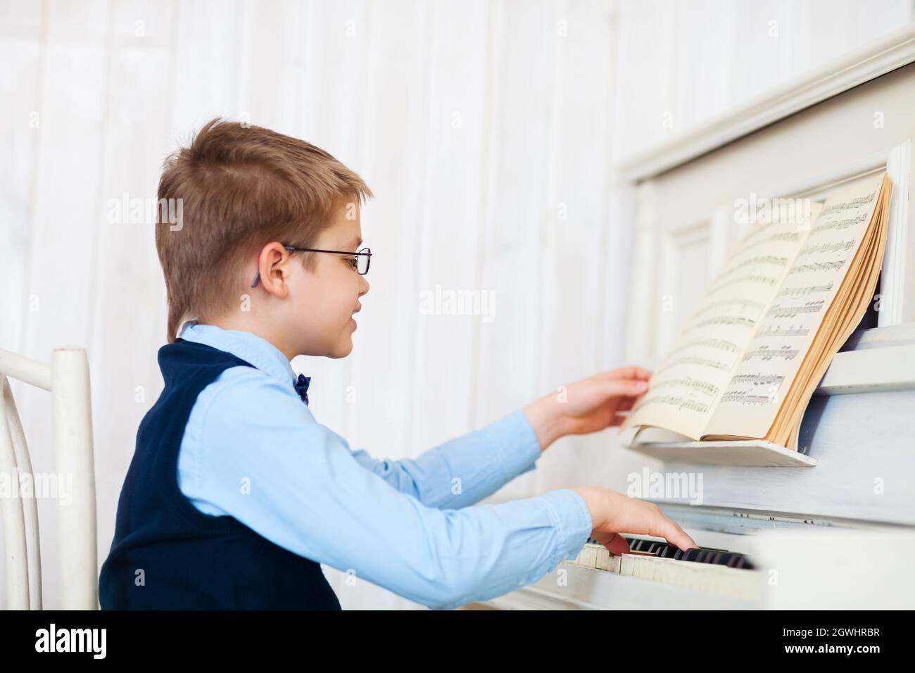 Blond school boy musical instrument hi-res stock photography and images ...