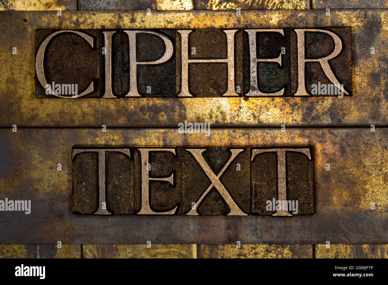 Cipher Text text on textured grunge copper and vintage gold background ...