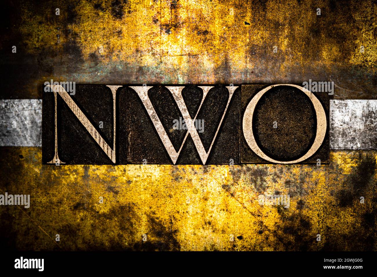 NWO text on textured grunge copper and vintage gold background Stock ...