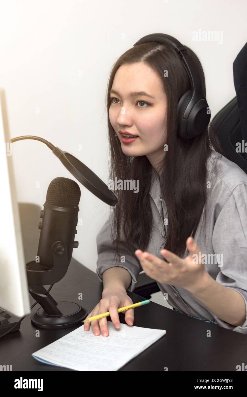 Commentator talking speaking into microphone hi-res stock photography ...