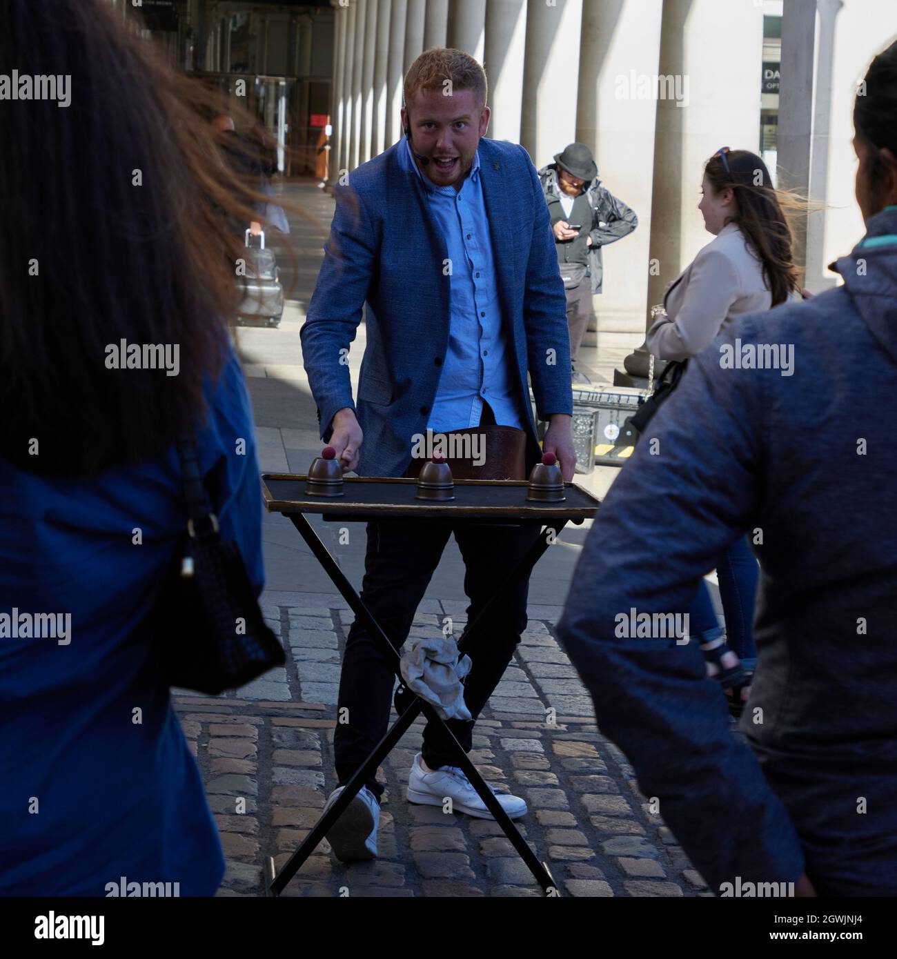 Magician busker entertaing the crowd in Covent Garden UK Stock Photo ...
