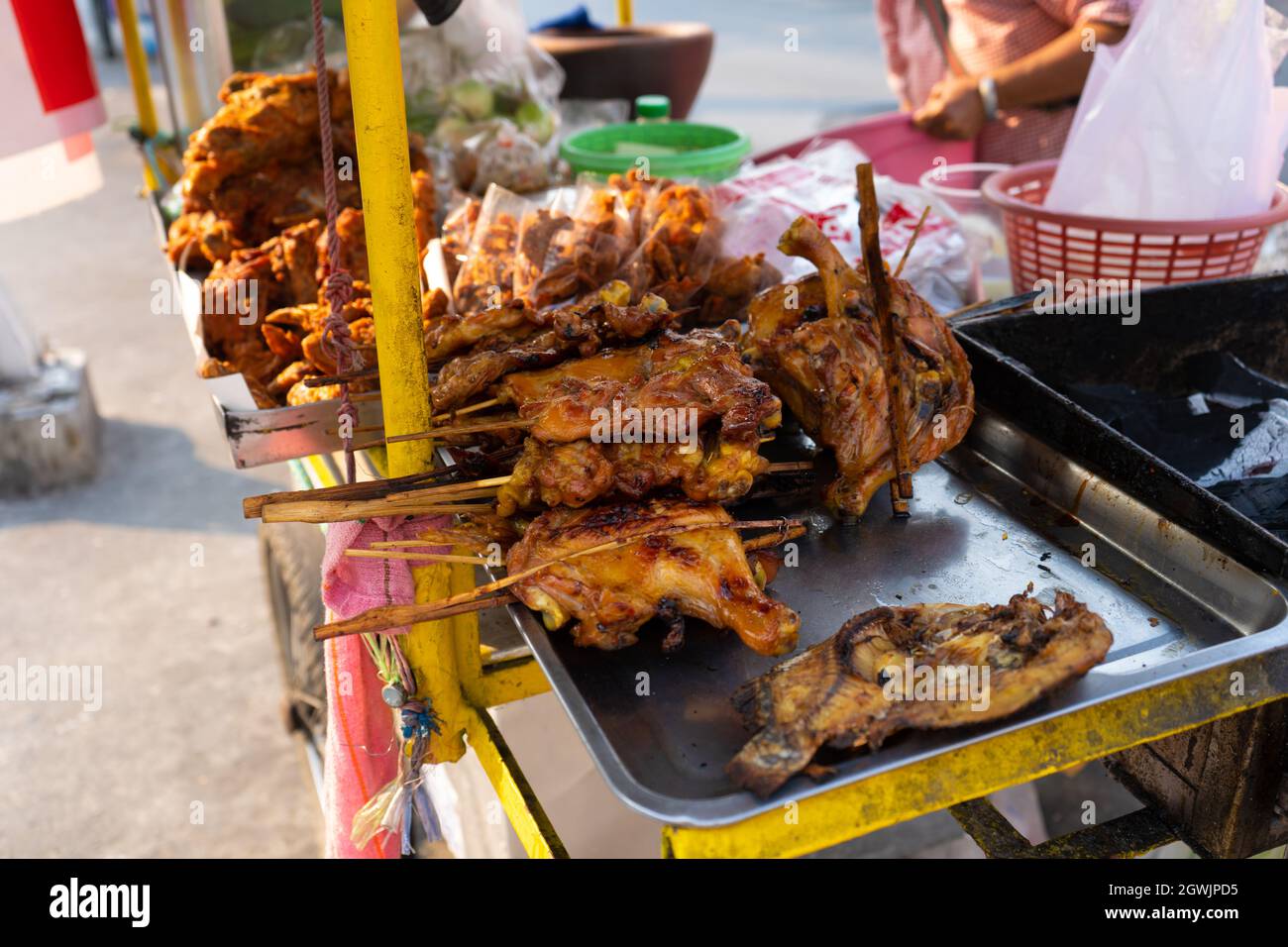 Snack and fried chicken stall at a market in Asia Stock Photo - Alamy