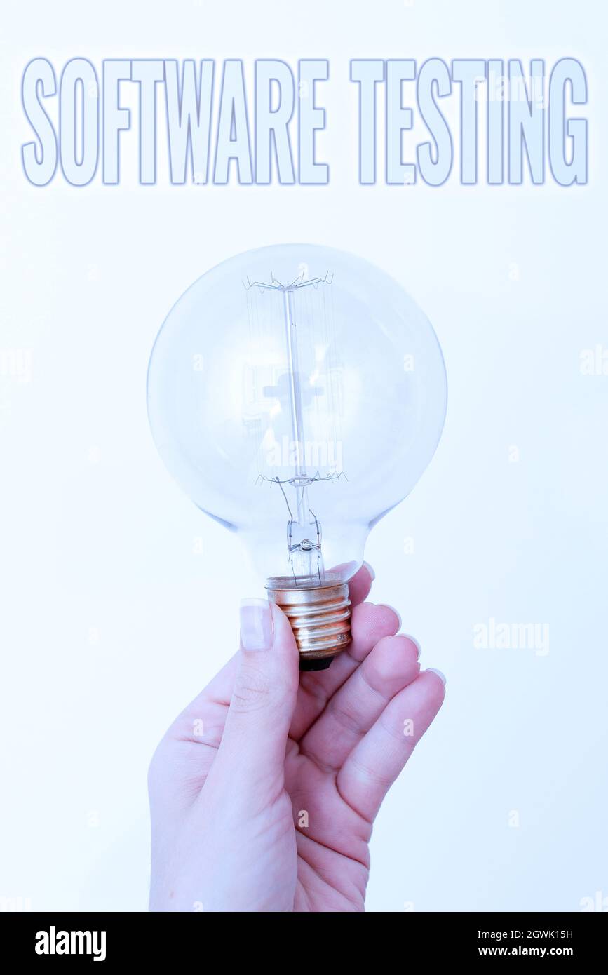 Hand Writing Sign Software Testing Word Written On Evaluate The Functionality Of A Software