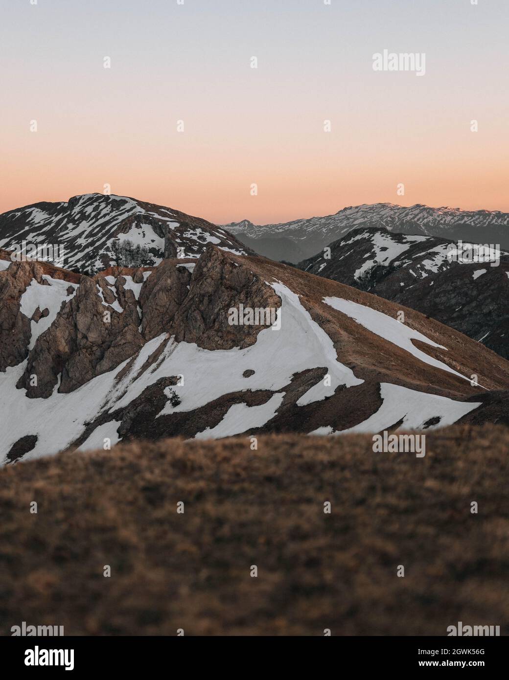 A vertical shot of a beautiful mountainous area covered with snow ...
