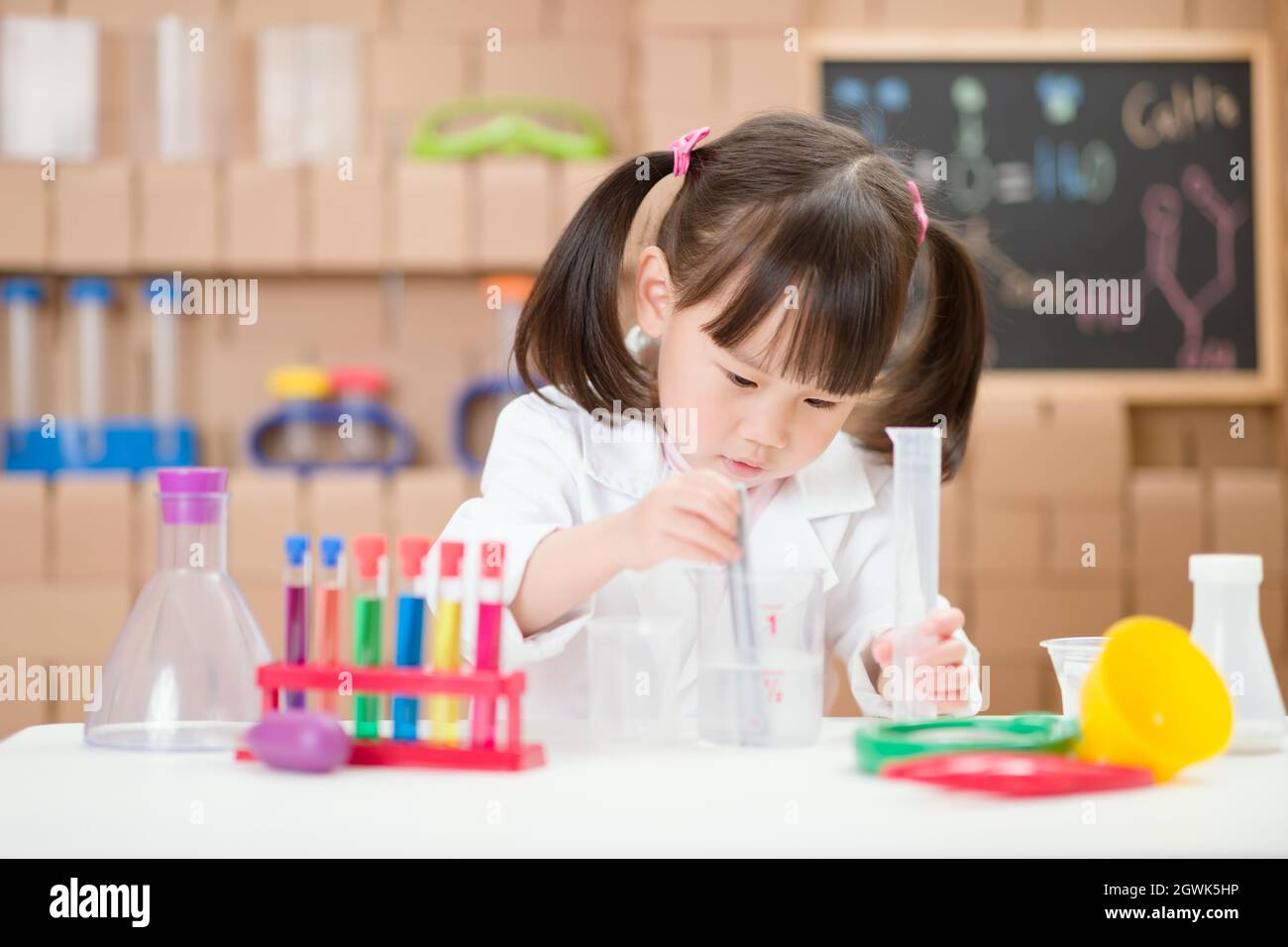 Children playing science equipment hi-res stock photography and images ...