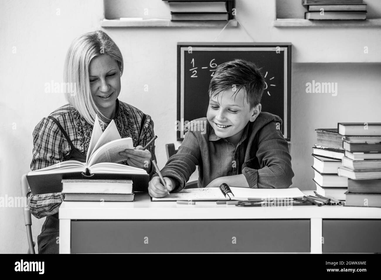 Primary school student tutor Black and White Stock Photos & Images - Alamy