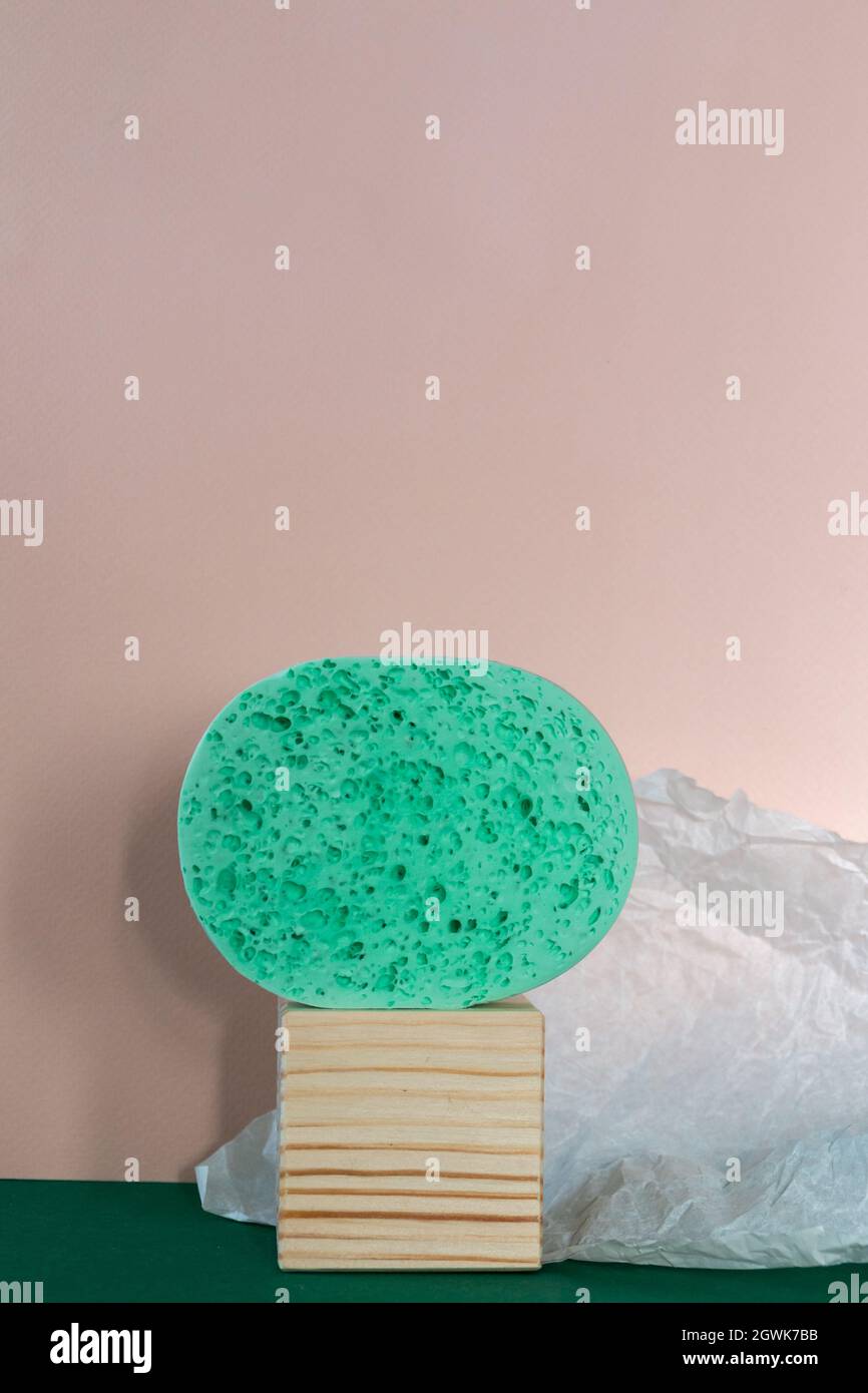 face cleaning sponge on a wooden cube, balancing still life retro ...