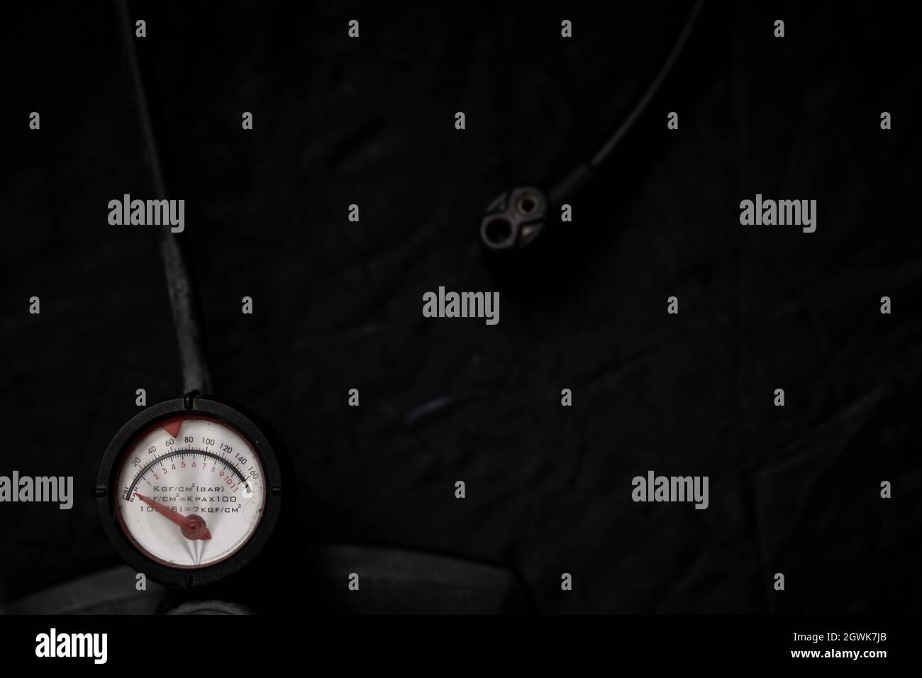 bicycle pump with a measure on a dark background. copy of the space ...