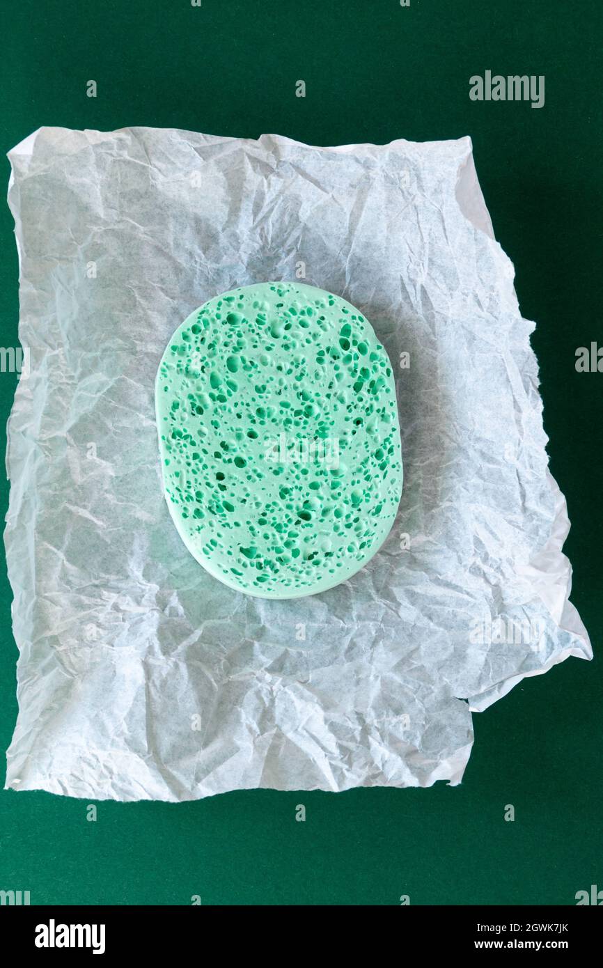 face cleaning sponge top view with crumpled packaging paper Stock Photo ...