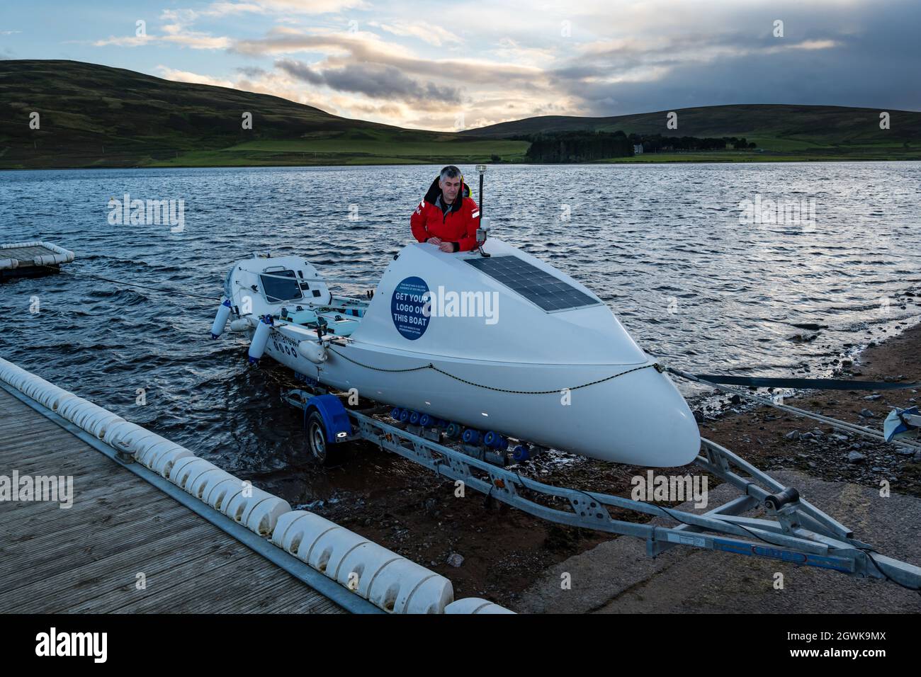 Men launch ocean rowing boat on Whiteadder Reservoir for a training ...